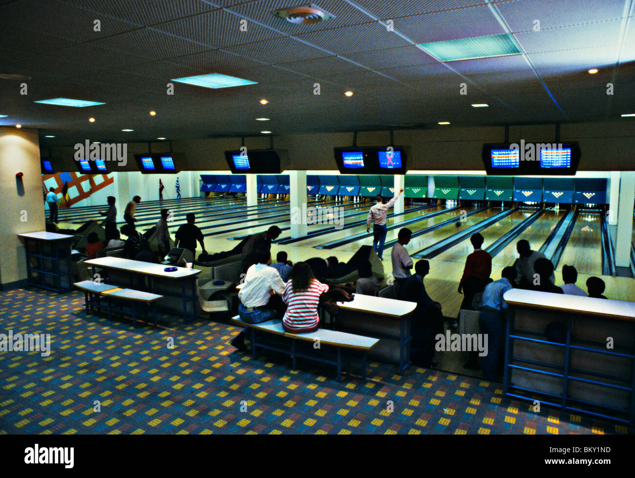 People in bowling alley playing games Stock Photo - Alamy