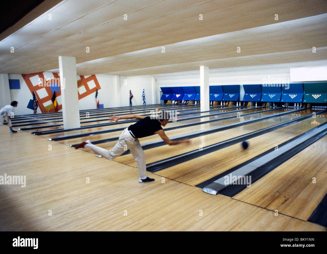 People bowling in a bowling alley Stock Photo - Alamy