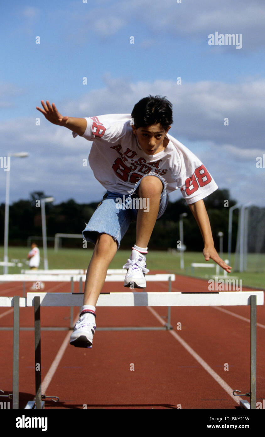 Boy running hurdles hi-res stock photography and images - Alamy