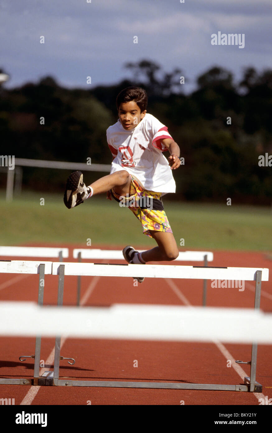 Boy running hurdles hi-res stock photography and images - Alamy
