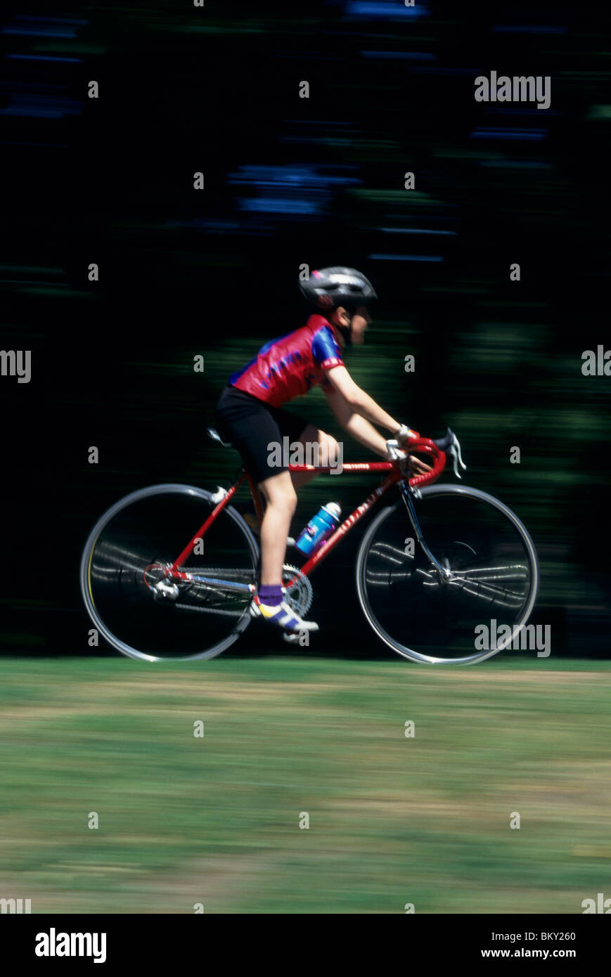 Moving shot of cyclist from side view Stock Photo - Alamy