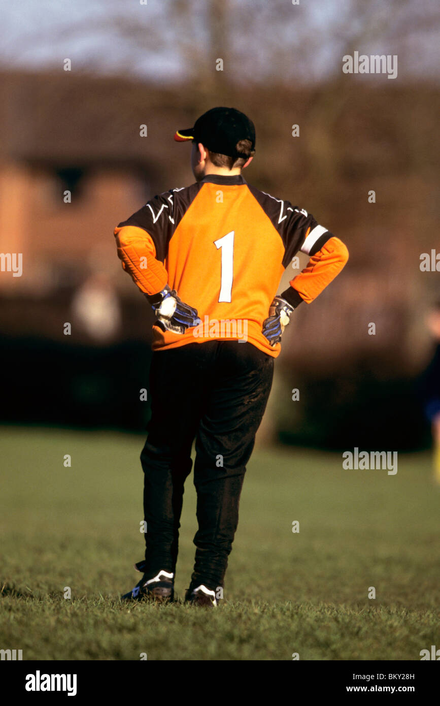 Goalie walking around pitch watches play Stock Photo - Alamy