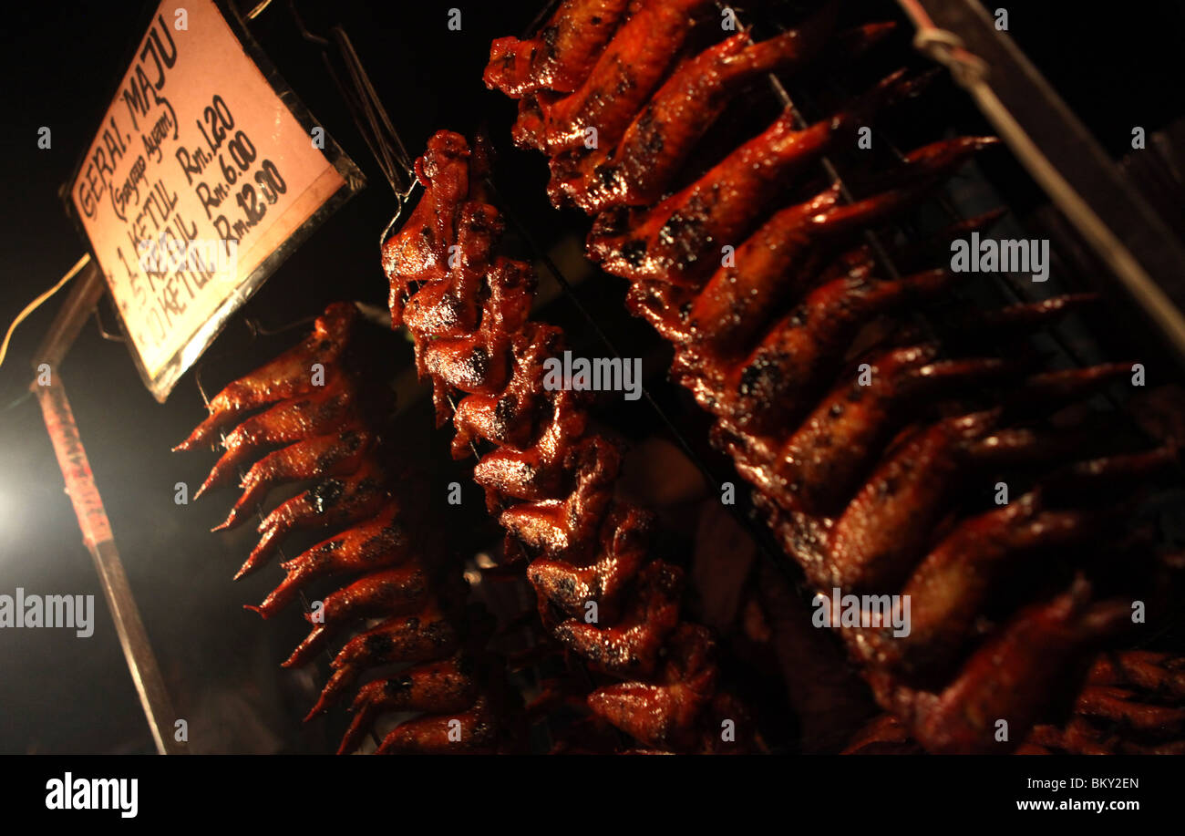 Barbecued chicken wings on display at the night market in Kota Kinabalu ...