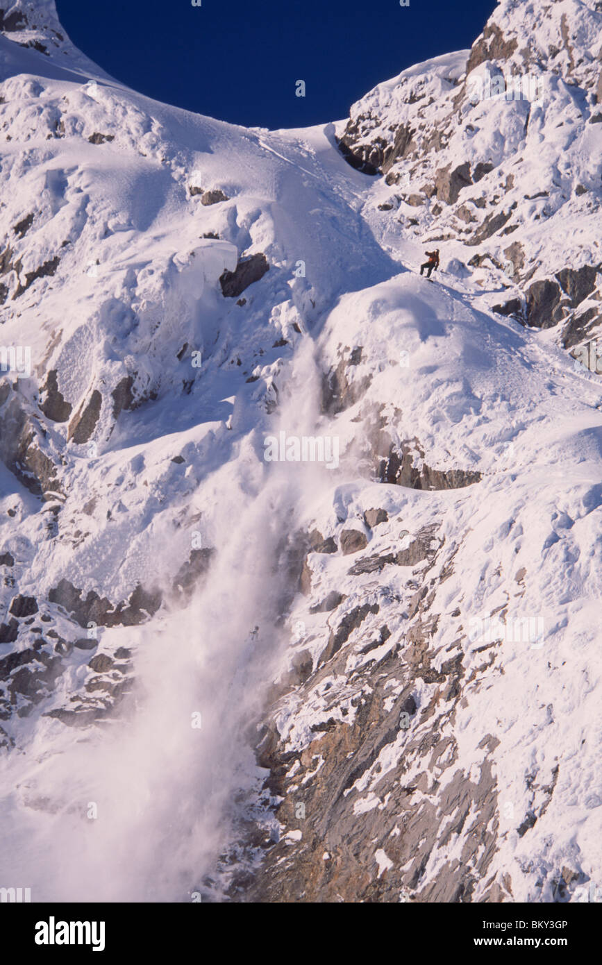 Man snowboarding a steep backcountry slope Stock Photo - Alamy