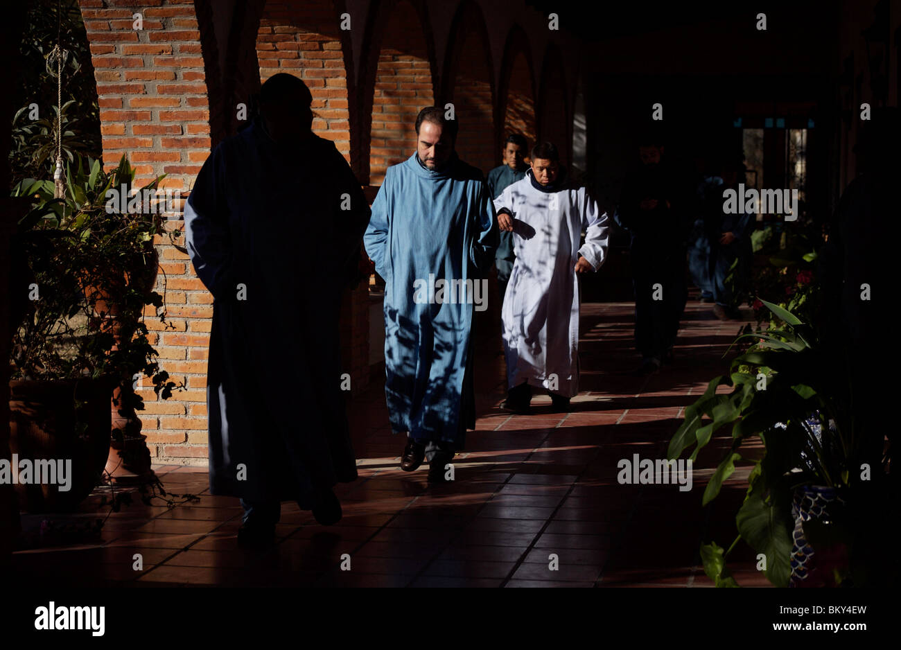 Monks walk in the cloister at Our Lady of Solitude monastery in ...