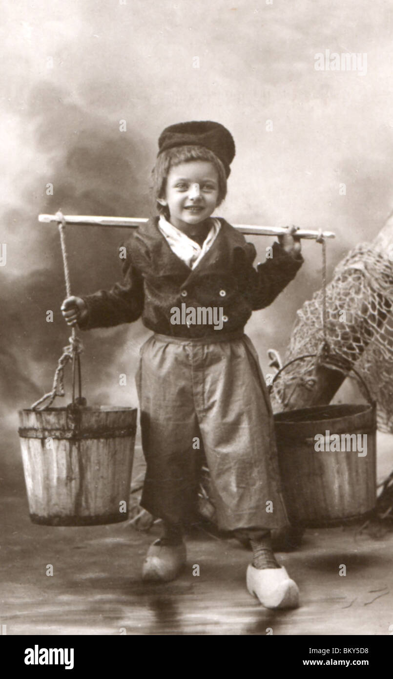 Children carrying water buckets on hi-res stock photography and images ...