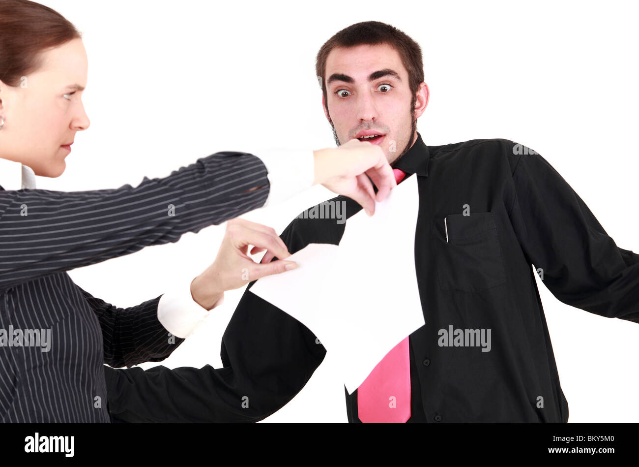 Portrait of two colleagues solving contract problem, studio shot Stock ...