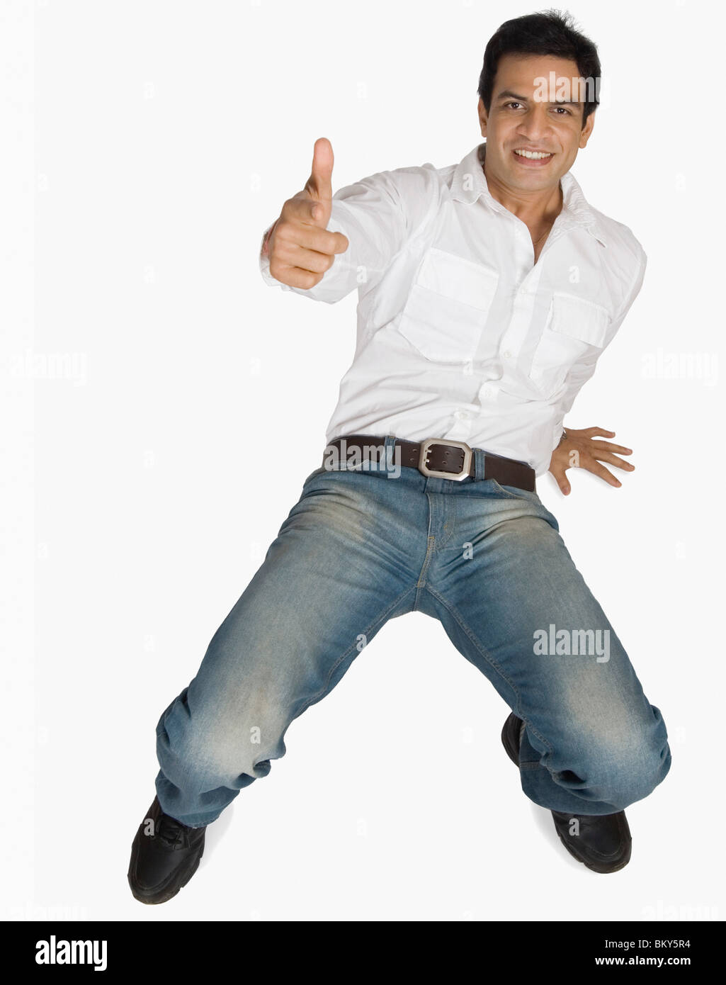 Portrait of a man pointing and smiling Stock Photo - Alamy