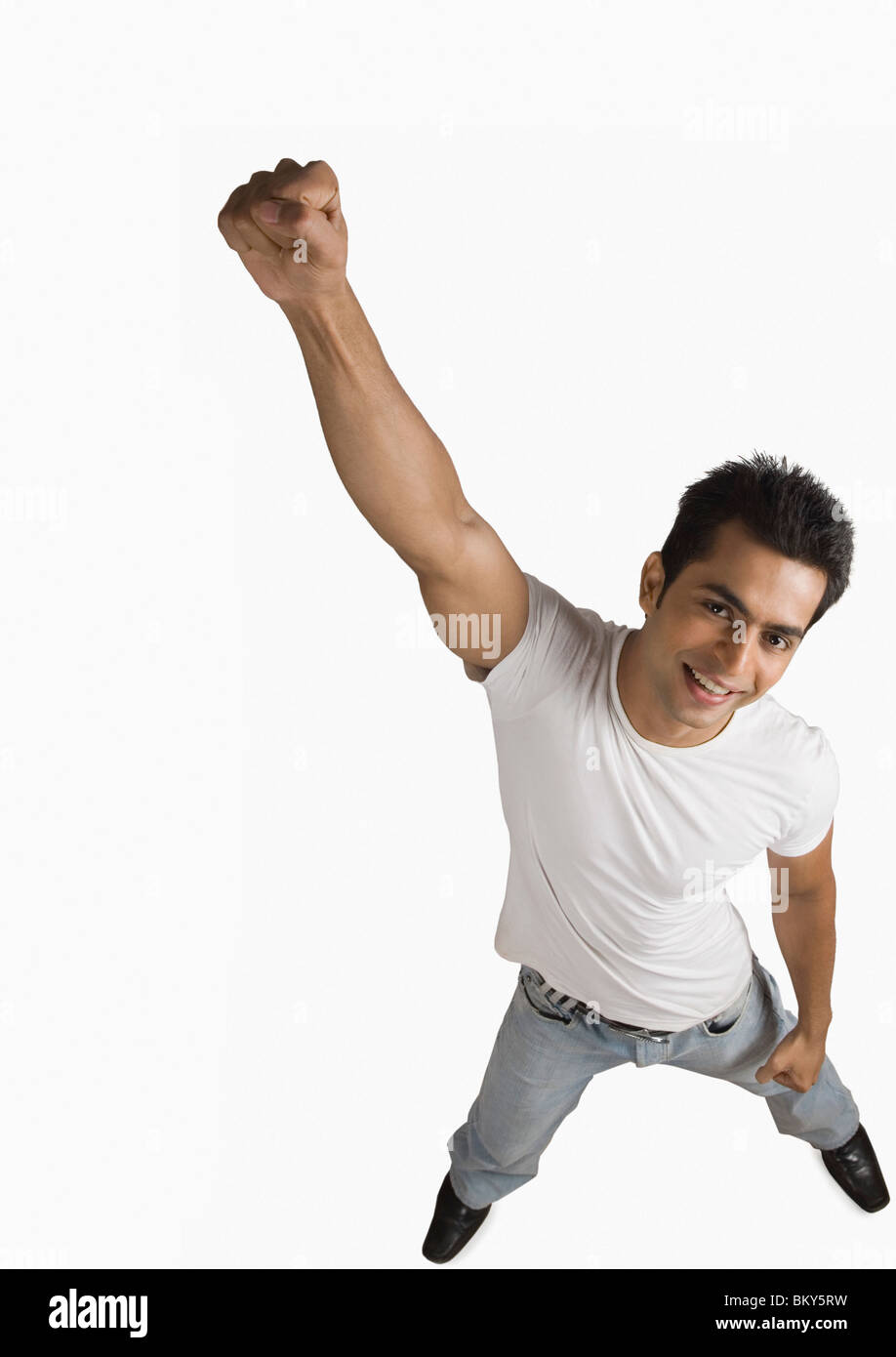 Man standing with hand raised Stock Photo - Alamy