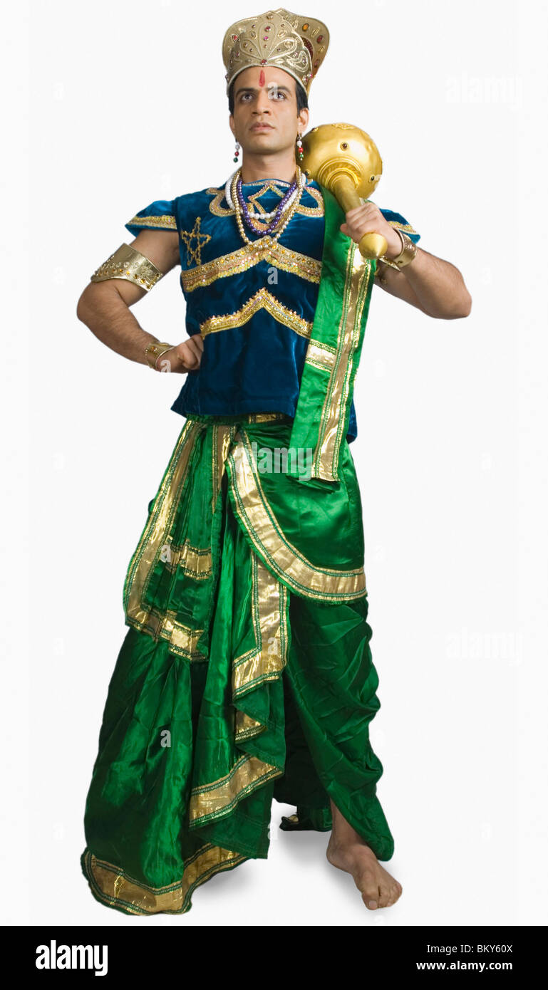 Man dressed-up as mythological character holding a mace Stock Photo - Alamy