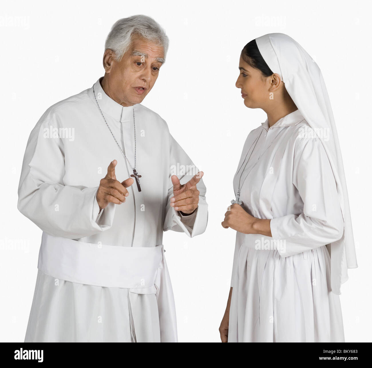 Priest talking to a nun Stock Photo - Alamy
