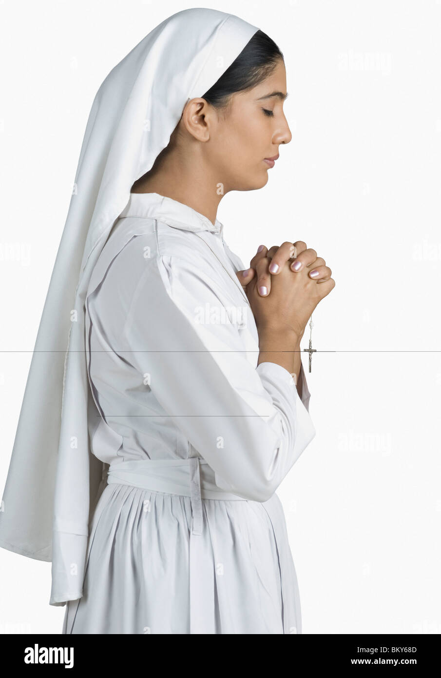 Cross hands praying Cut Out Stock Images & Pictures - Alamy