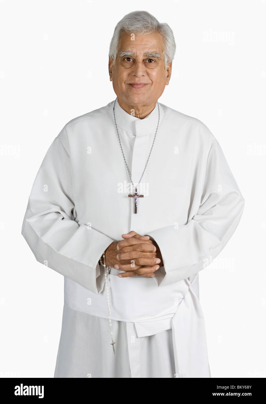 Portrait of a priest smiling Stock Photo - Alamy