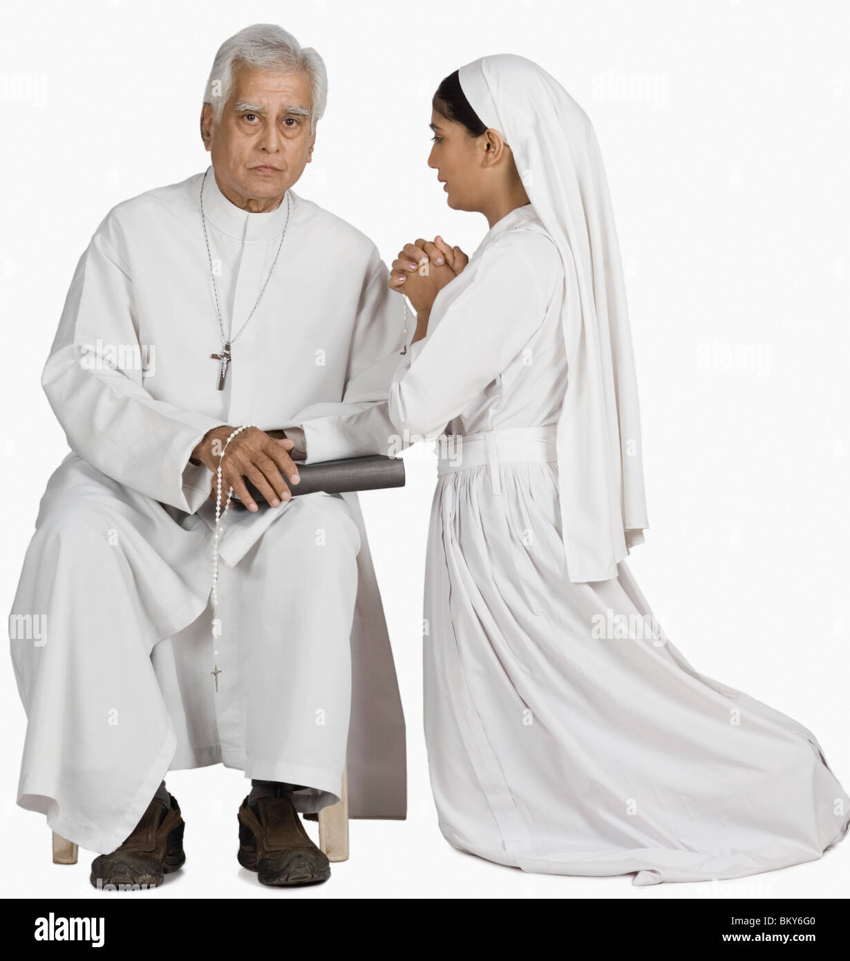 Nun confessing her sins to a priest Stock Photo - Alamy