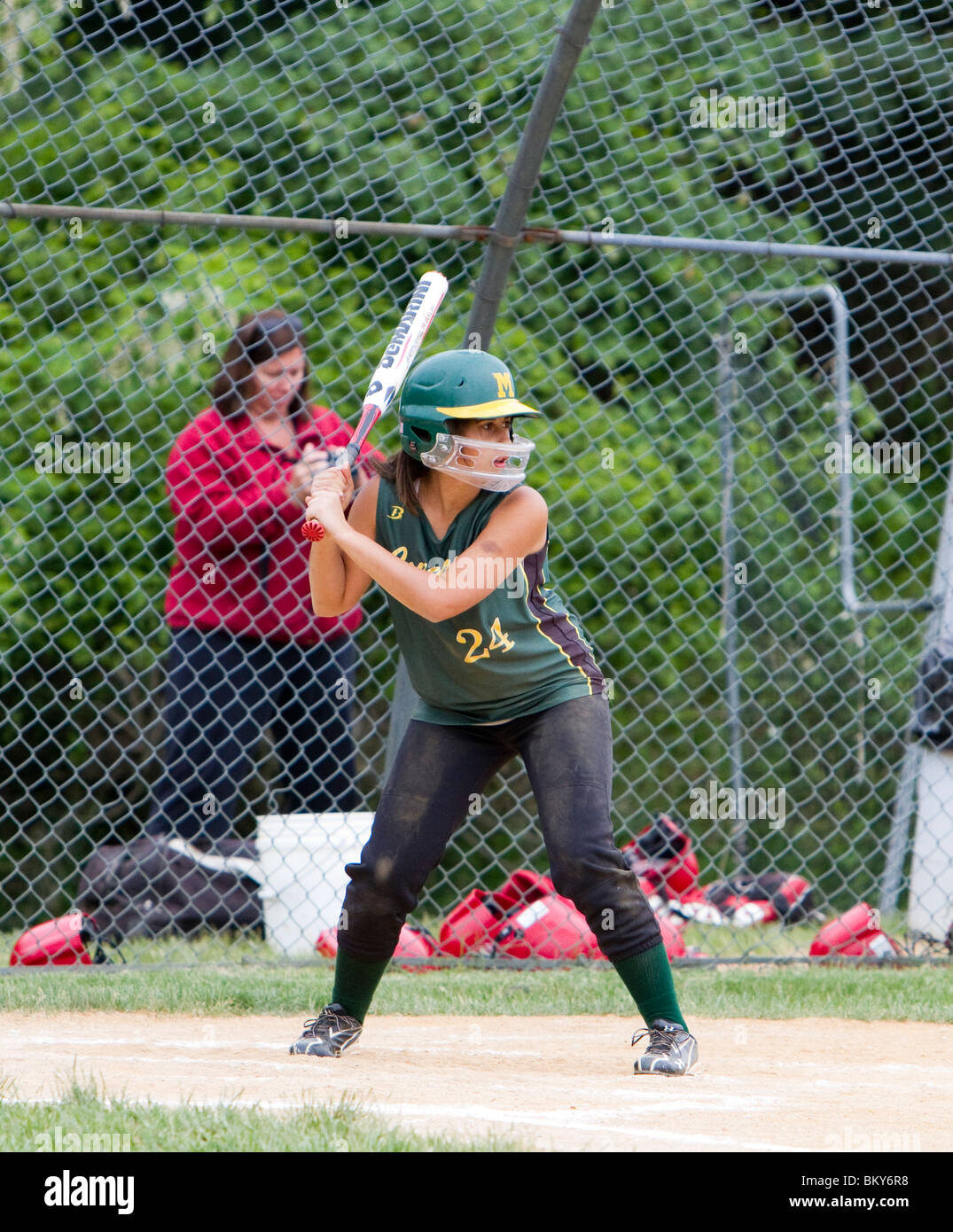 A high school girls softball game. A batter at bat at home plate Stock ...