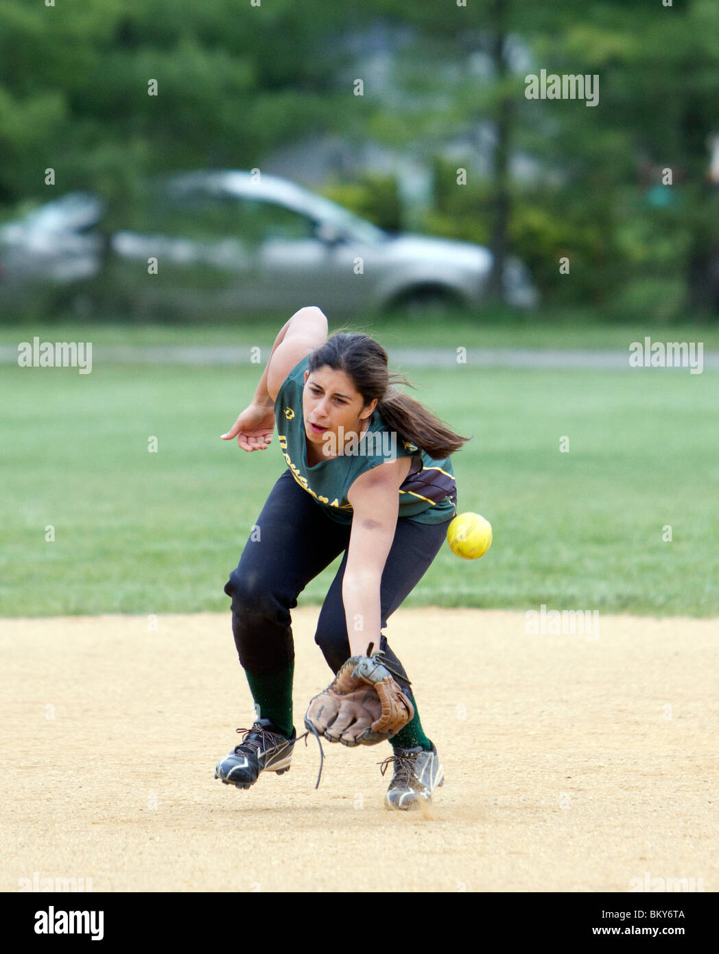Girls high school softball. Catching running throwing. Teenage girls ...
