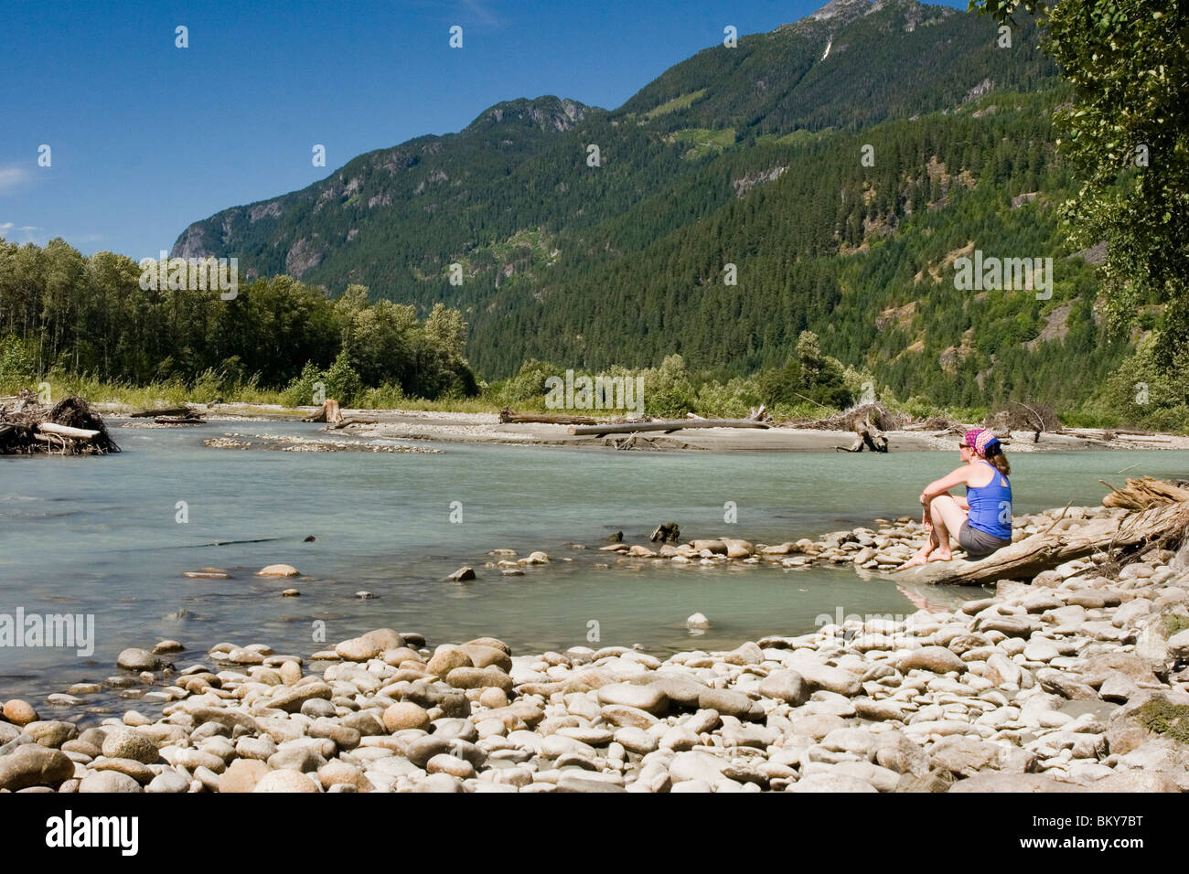 A woman in her late twenties cools off at the Squamish River after a ...