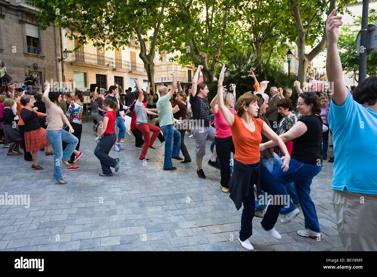 People dancing on a square in the old town of Palma, Mallorca, Spain ...