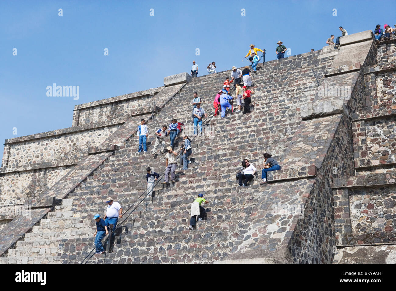Tourists climbing the steps of the moon pyramid of Teotihuacan, Mexico ...