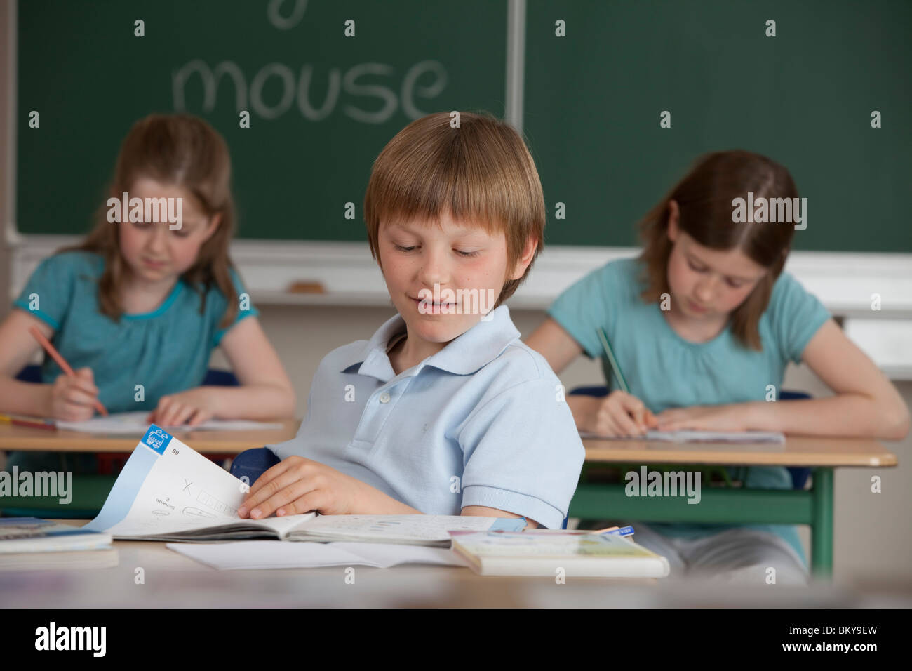 Three pupils in classroom hi-res stock photography and images - Alamy