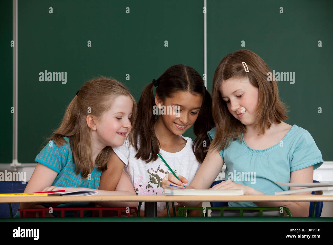 Three schoolgirls in classroom, Hamburg, Germany Stock Photo - Alamy
