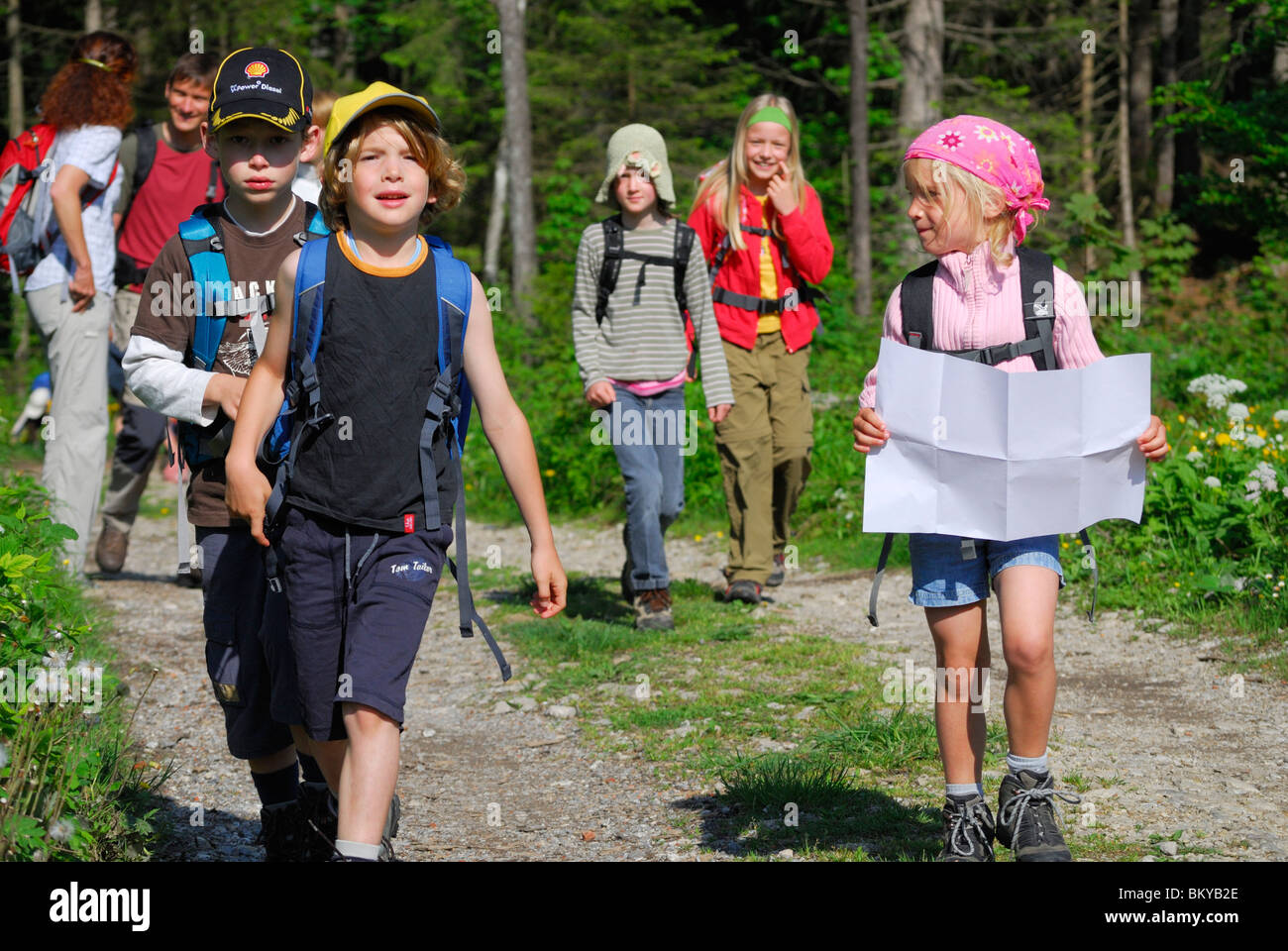 Group of hikers with children, girl reading a map, Bavarian Alps, Upper ...