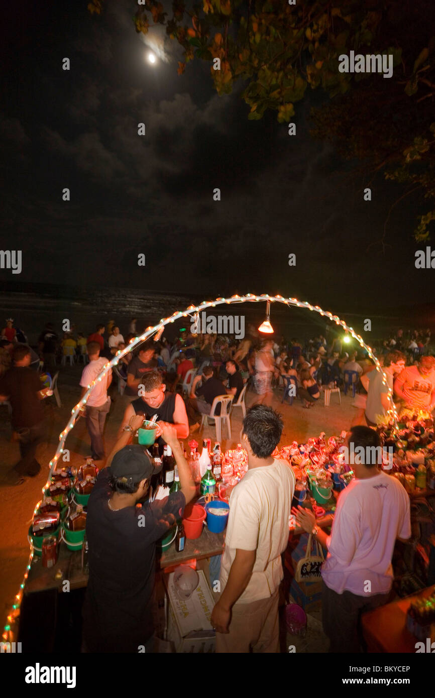 Young people at a Full Moon Party, bar in foreground, Hat Rin Nok ...