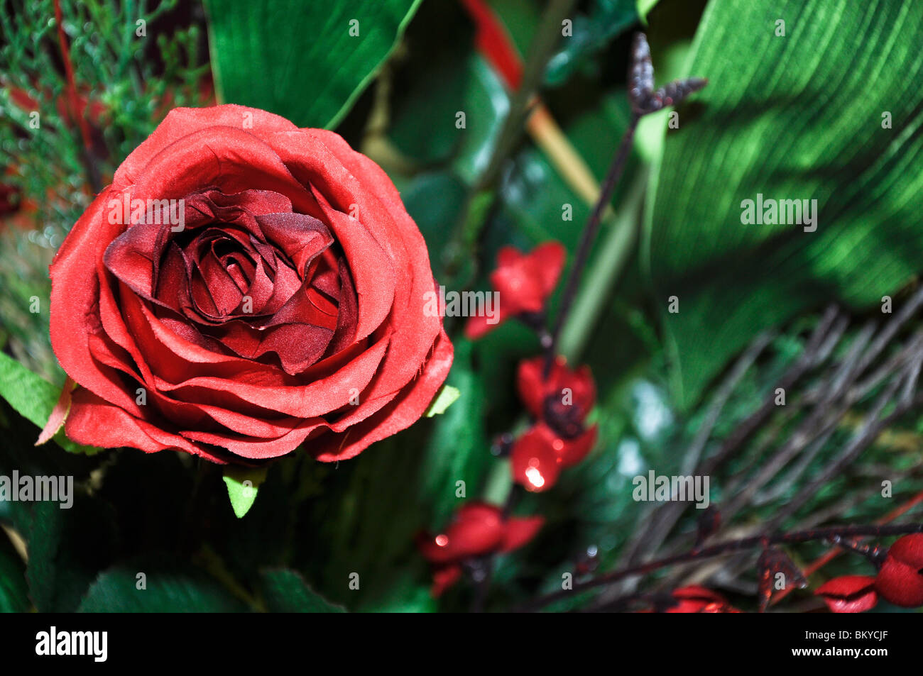 Artificial red rose display Stock Photo - Alamy