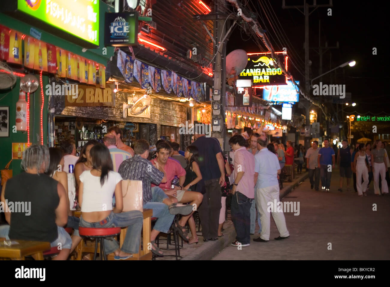 Tourists sitting in open-air bars at Bang-La Road in the evening, bar ...