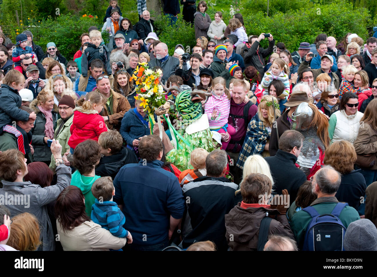 Green Man walks through a crowd at Green Man Festival, Clun, Shropshire ...