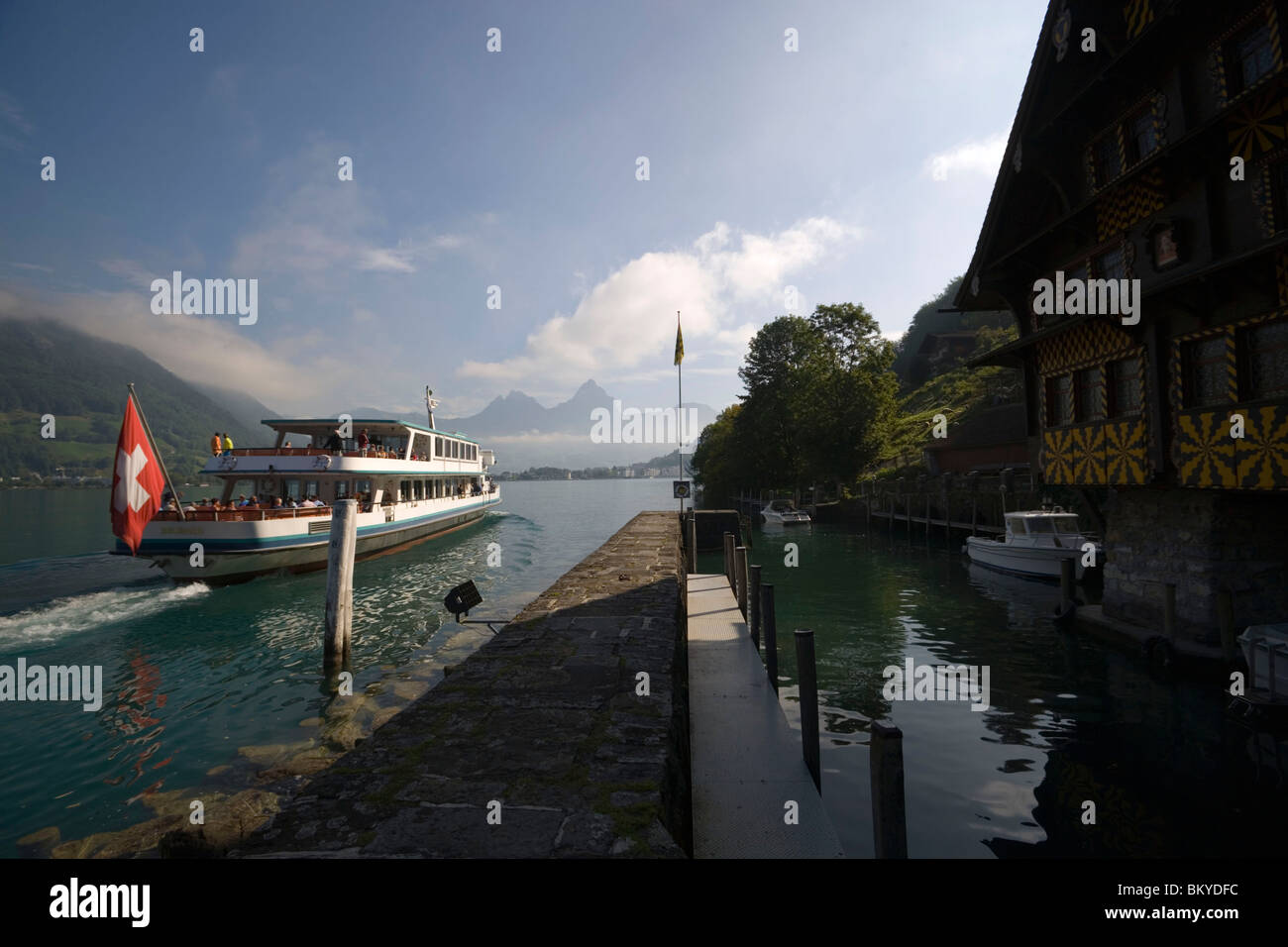 MS Brunnen on Lake Lucerne passing the former shelter harbour Treib ...