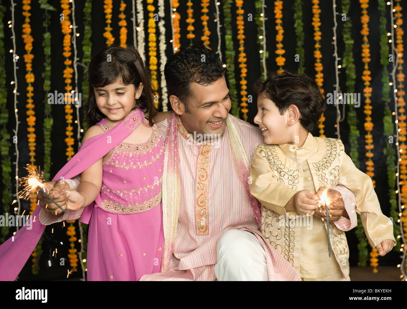 Family celebrating Diwali Stock Photo - Alamy