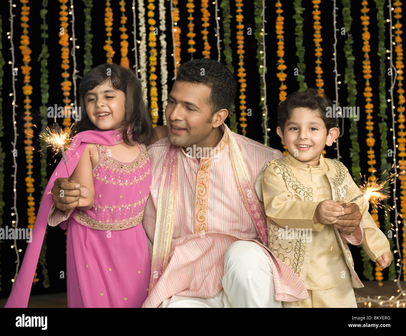 Family celebrating Diwali Stock Photo - Alamy