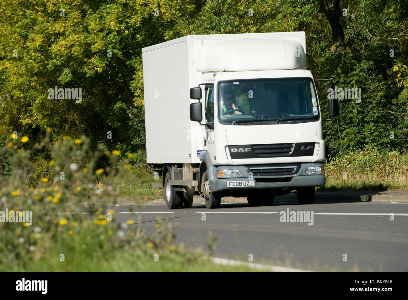 White DAF truck travelling along a rural road in England Stock Photo ...