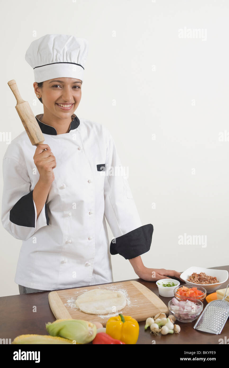 Female chef preparing food in the kitchen Stock Photo - Alamy