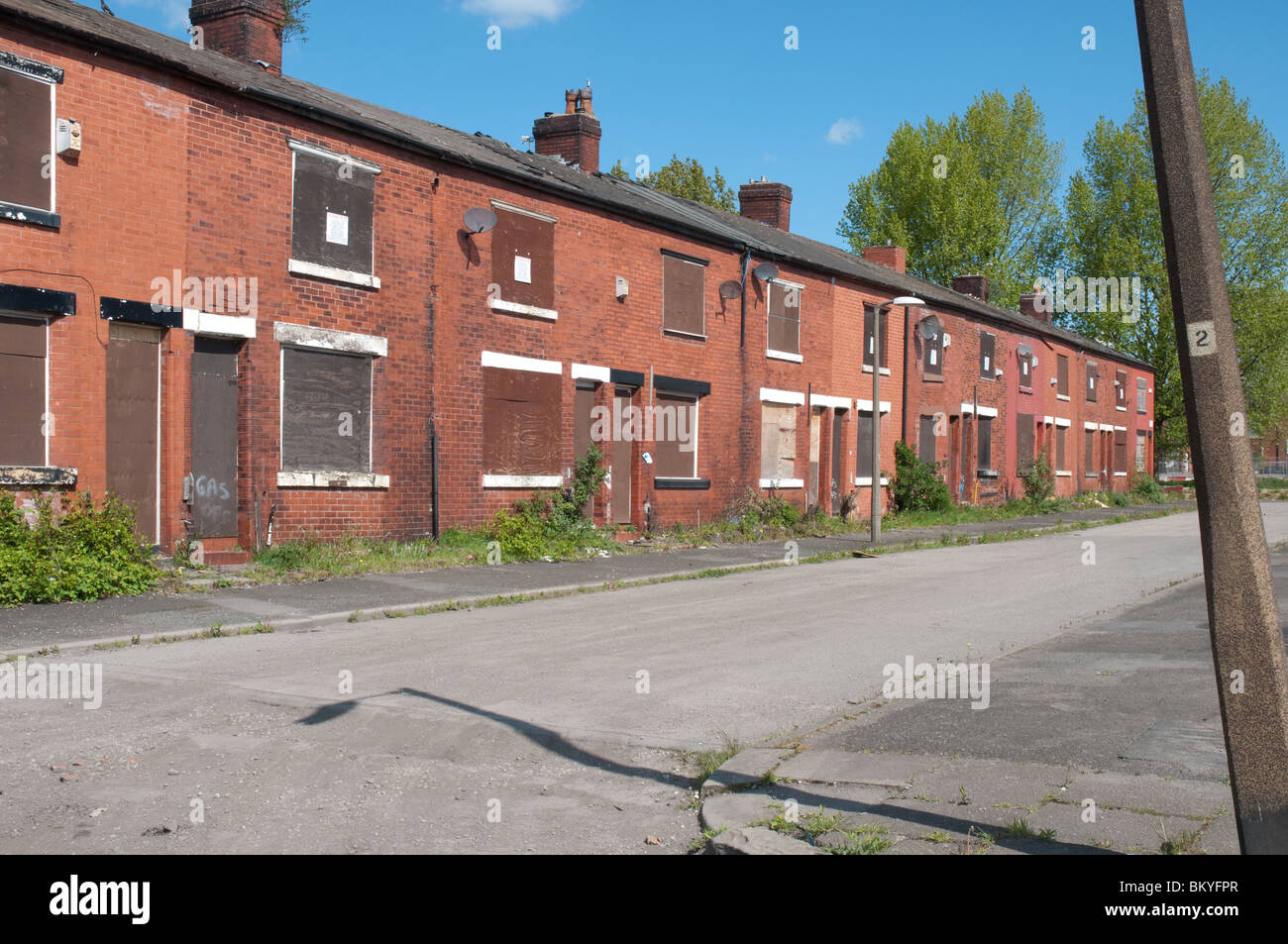 Row of boarded-up terrace houses in East Manchester, prior to ...