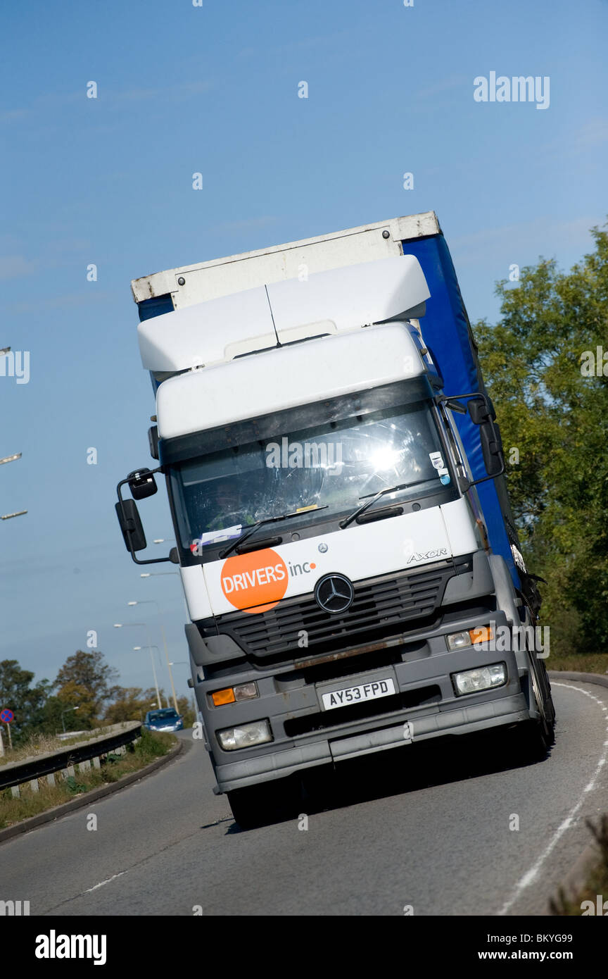Mercedes Actros lorry on a busy dual carriageway in England Stock Photo ...