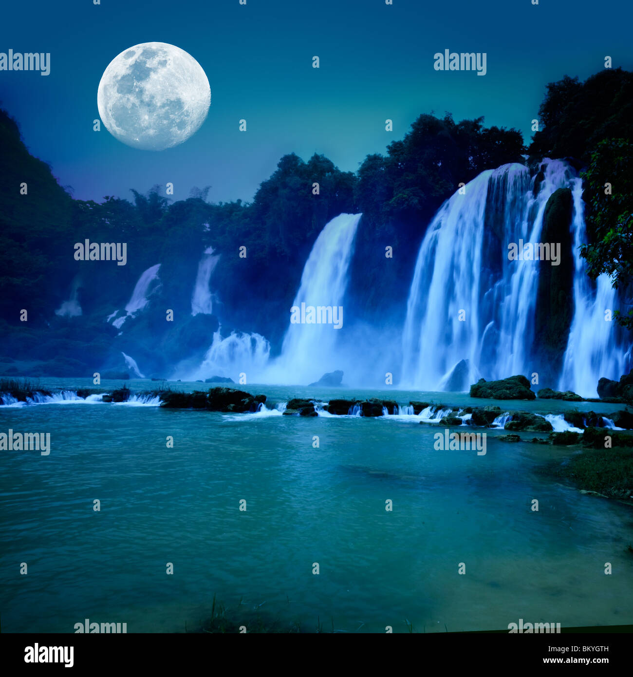 Beautiful waterfall under moonlight at night time Stock Photo - Alamy