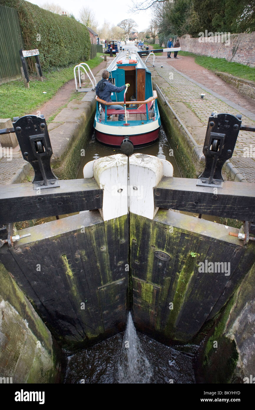 canal narrow boat in lock with water leaking through gates Stock Photo ...