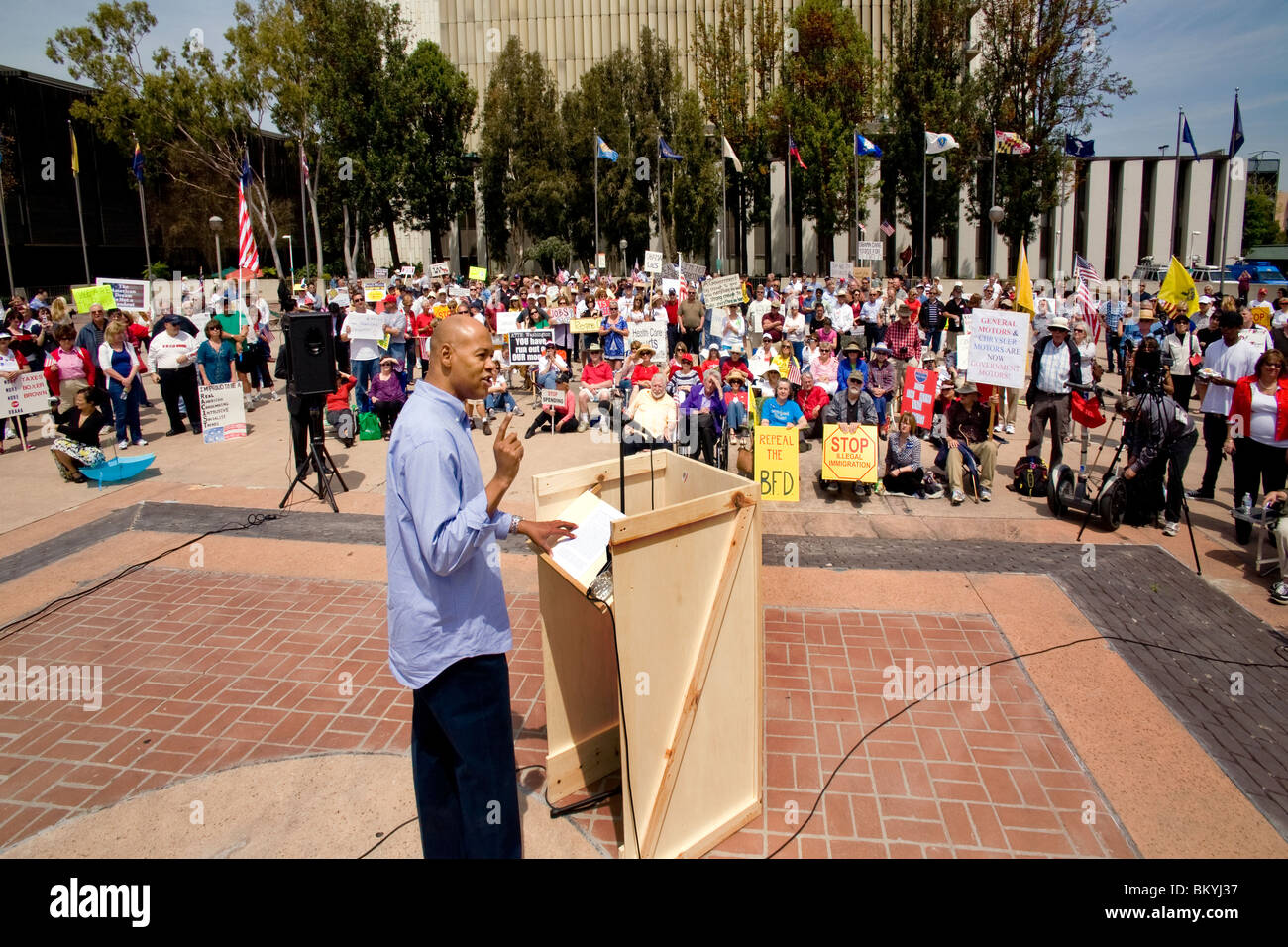 An angry African American speaker harangues the crowd at a "Tea Party ...