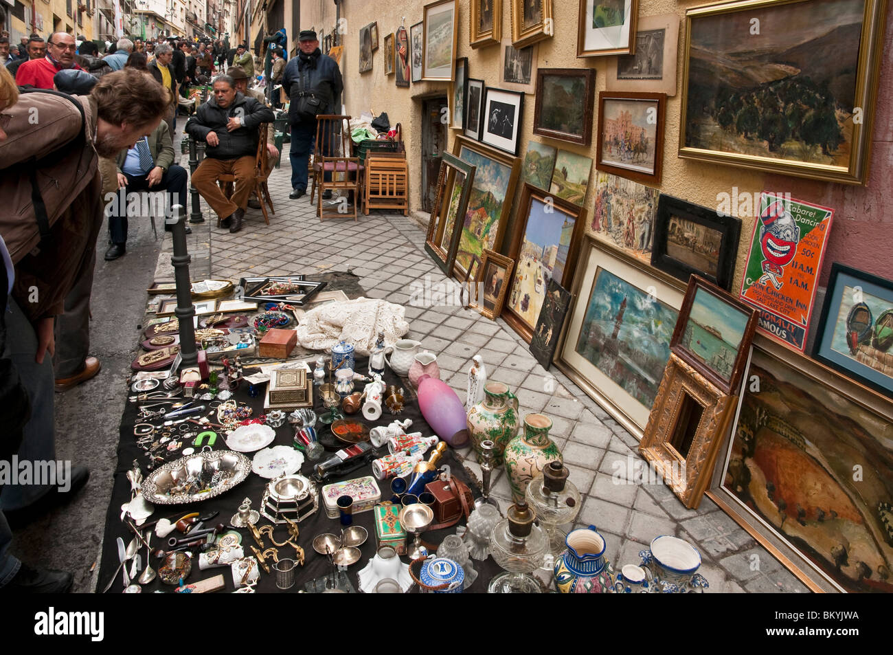 Pavement stalls in the Rastro flea market around Lavapies and ...