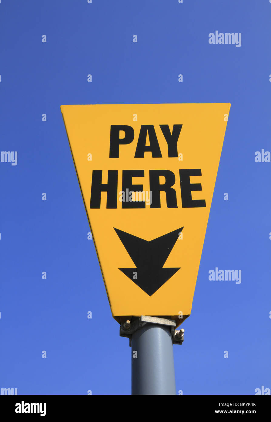 A sign directs patrons to the pay station at a car park in Eastbourne ...
