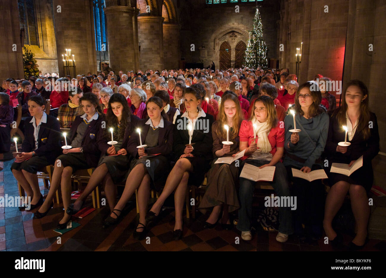 Congregation singing and holding candles during filming of BBC Songs of ...