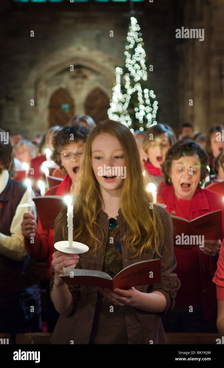 Congregation singing and holding candles during filming of BBC Songs of ...