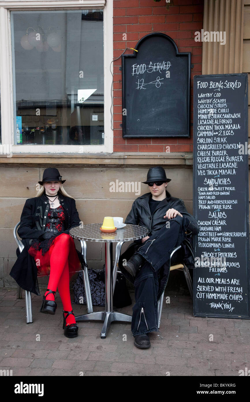 Gothic couples;Couple, in fancy dress, sat outside a pub bar, where ...