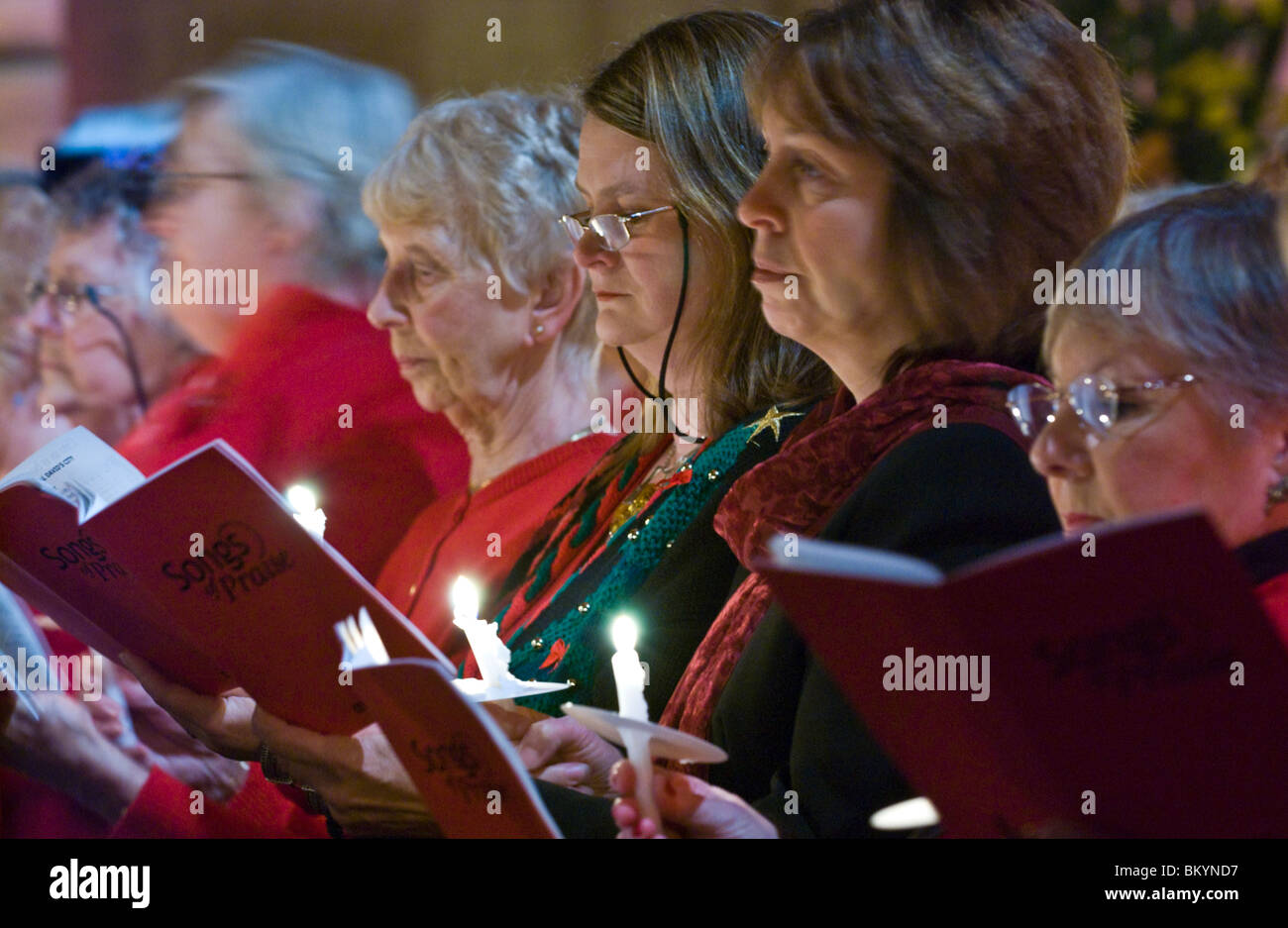 Congregation singing and holding candles during filming of BBC Songs of ...