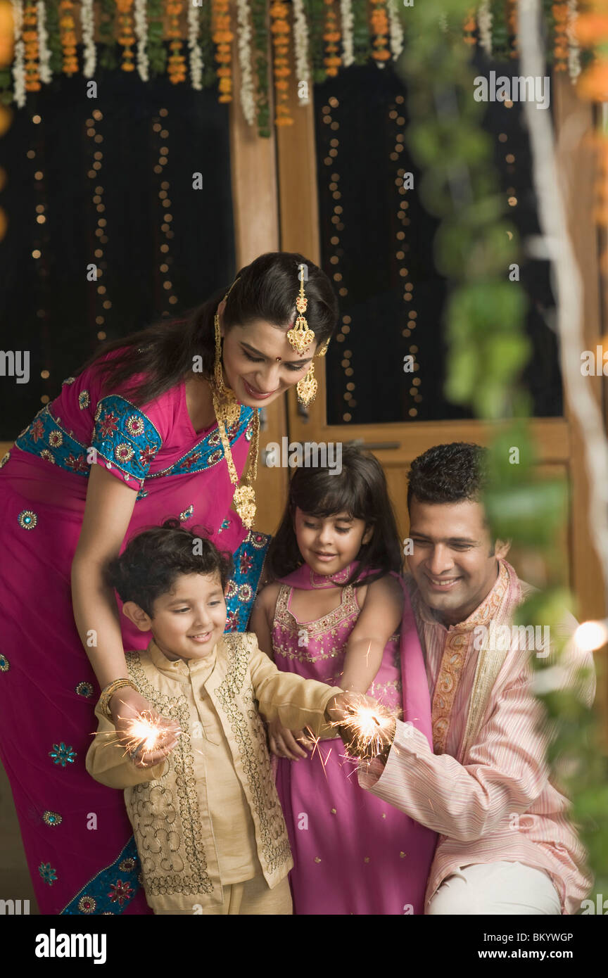Family celebrating Diwali Stock Photo - Alamy
