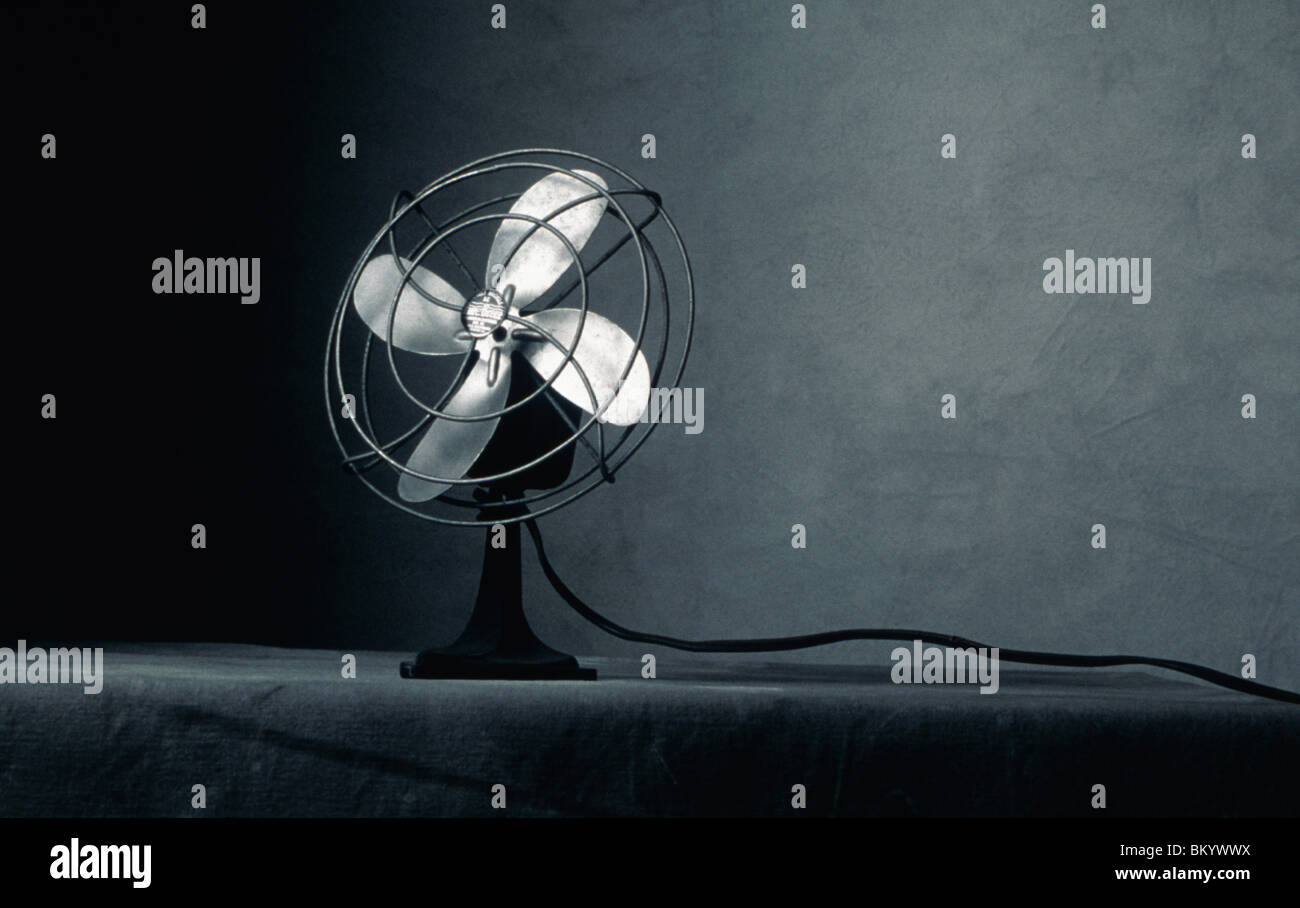 Old fashioned fan on grey background Stock Photo - Alamy