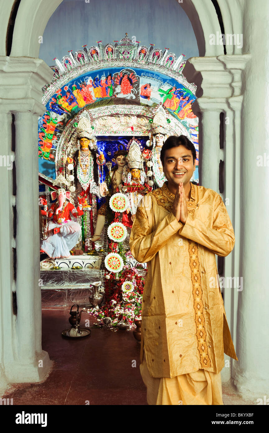 Man praying in a temple Stock Photo - Alamy