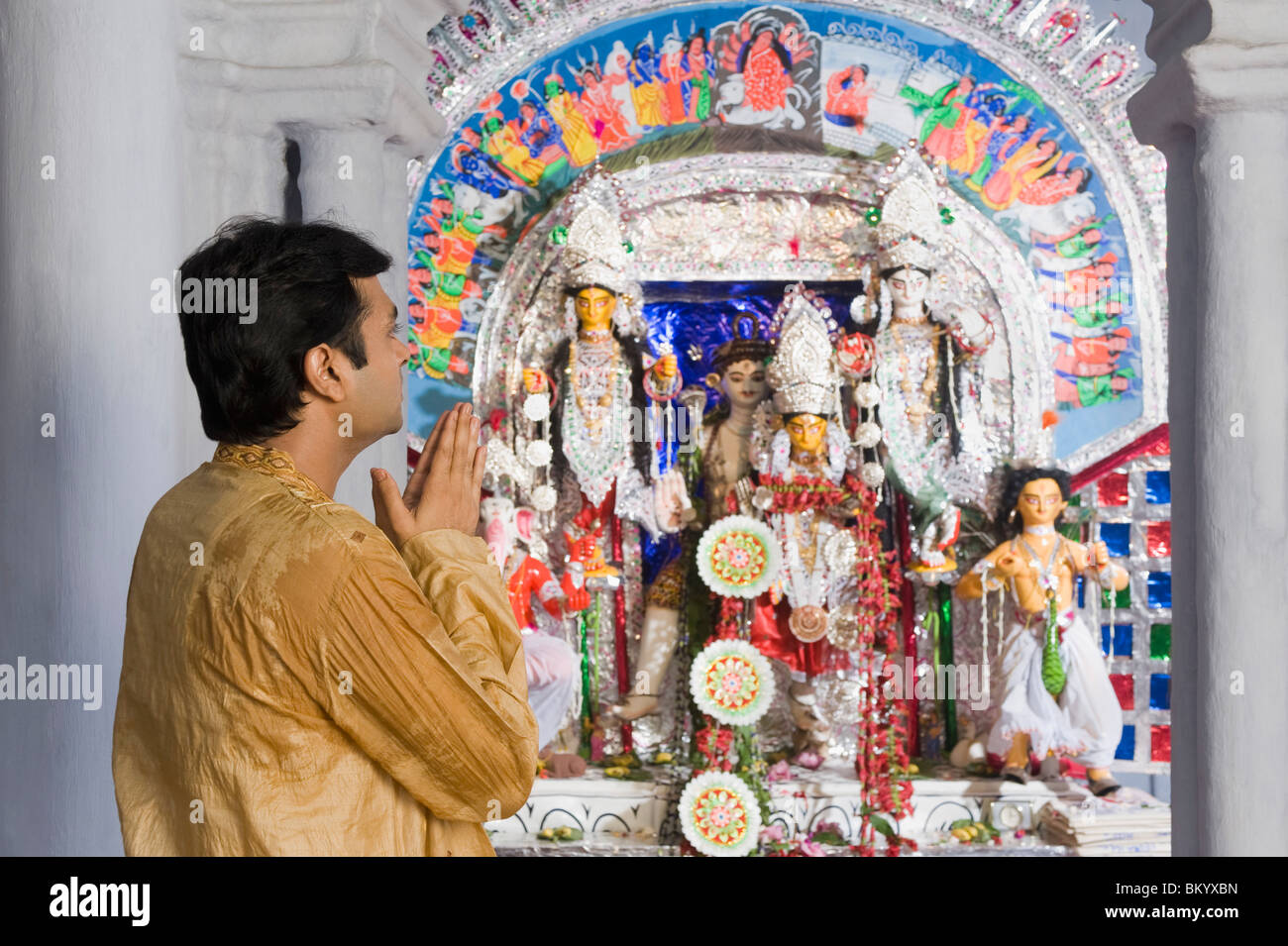 Man praying in a temple Stock Photo - Alamy